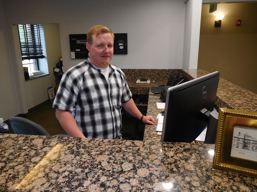 Caleb the front desk clerk at the Calvert Hotel | Prof. Jay Zagorsky